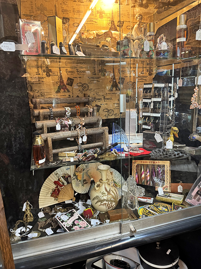 Behind glass but full of stories &ndash; these delicate treasures and vintage fans wait for someone who appreciates their journey through time.