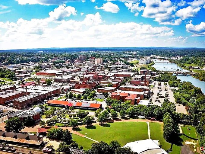 Bird's eye bargain! This aerial view of Danville showcases the compact downtown nestled along the Dan River&mdash;where your retirement dollars stretch as far as this vista.