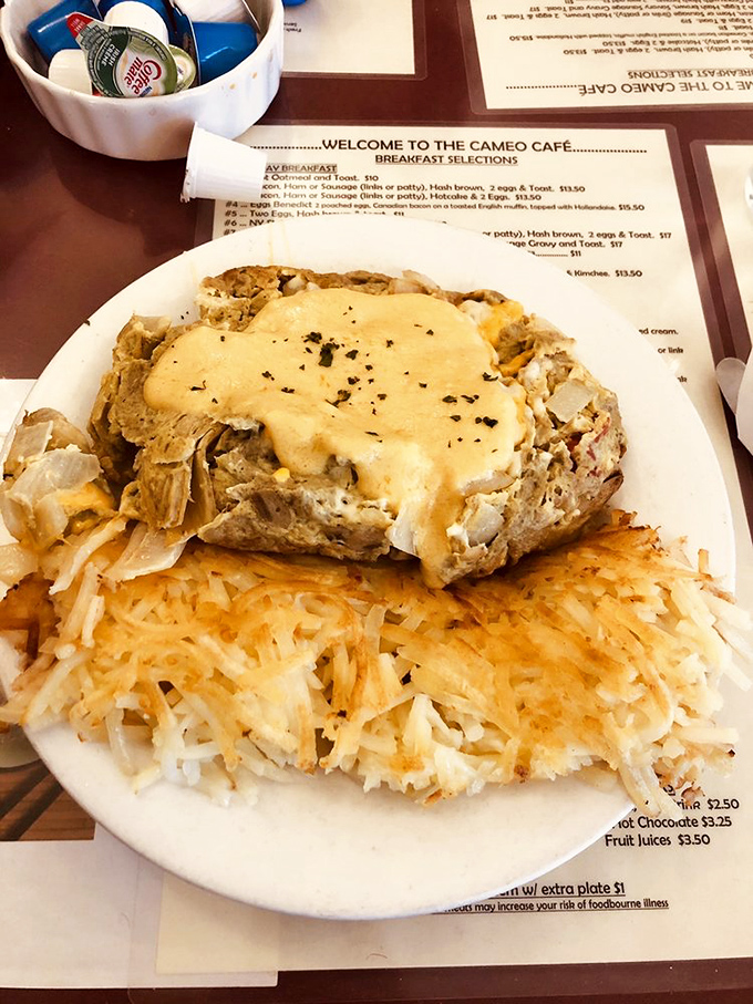 This isn't just an omelet&mdash;it's a golden sunrise on a plate, with cheese cascading over vegetables like morning light through windows. 