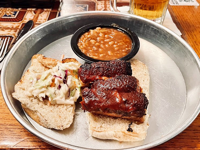 These ribs don't just fall off the bone&mdash;they practically leap onto that bread with purpose. The BBQ beans? Non-negotiable.