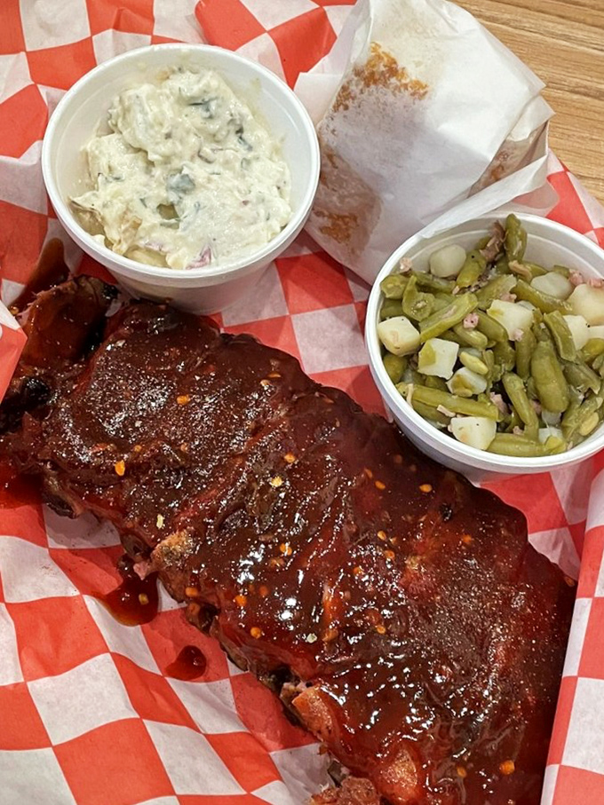 The holy trinity of BBQ: perfectly sauced ribs, creamy potato salad, and green beans that actually taste like vegetables should.