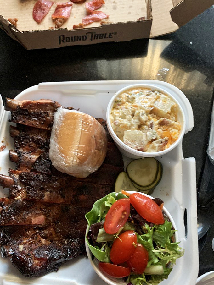 The holy trinity of barbecue: ribs with that perfect smoke ring, mac and cheese that's actually worth the calories, and a fresh salad for when your conscience calls.