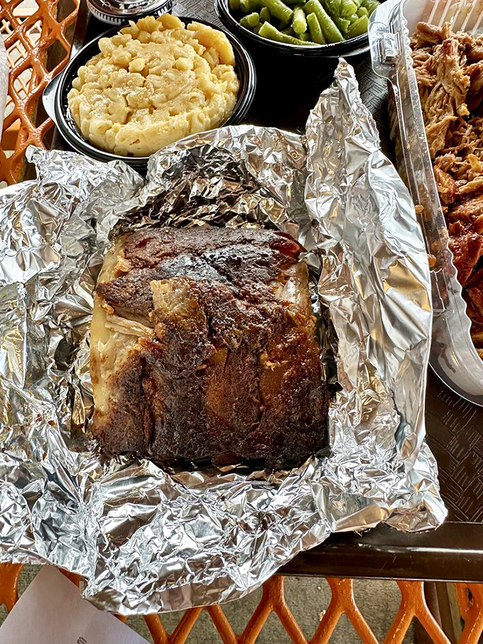 Ribs with that perfect bark, nestled beside creamy mac and cheese and green beans. This tray is the barbecue equivalent of hitting the lottery.