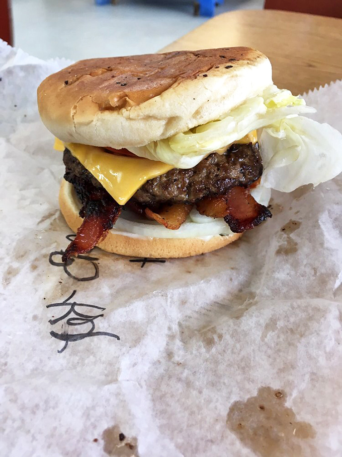 The bacon cheeseburger that launched a thousand road trips. Crispy bacon and melted cheese transform an already perfect burger into something transcendent.
