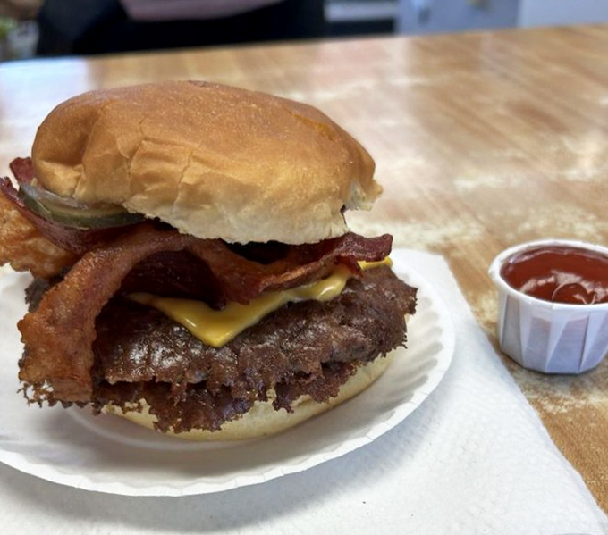 The bacon doesn't just sit on this burger&mdash;it stakes a claim, announcing "I belong here" with smoky confidence.