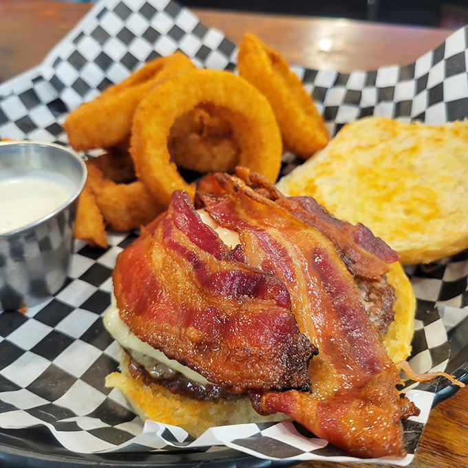 The bacon cheeseburger arrives with crispy onion rings like a superhero with delicious sidekicks. Kryptonite for diets everywhere.