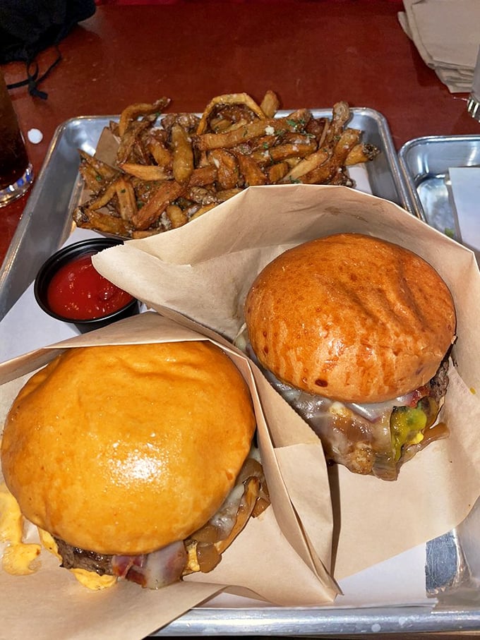 Two golden buns embracing a perfectly charred patty with all the fixings. Like a meat-lover's sonnet written in beef and bacon.