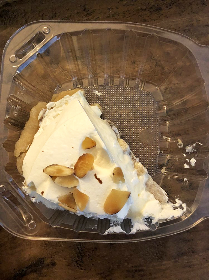 This slice of banana cream pie, topped with toasted almonds, is what clouds must taste like in dessert heaven.