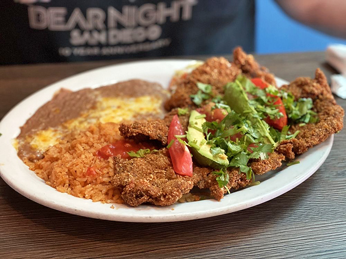 The Milanesa doesn't just sit on the plate&mdash;it commands attention like a Broadway star, with rice and beans as its talented supporting cast.