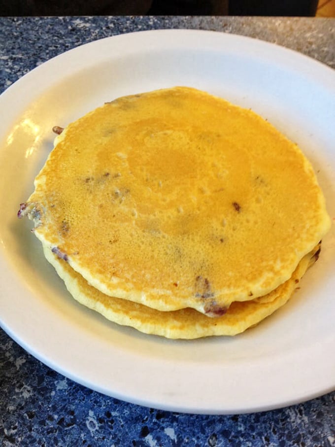 These pancakes aren't just food; they're edible evidence that someone in that kitchen understands the importance of proper golden-to-fluffy ratio.