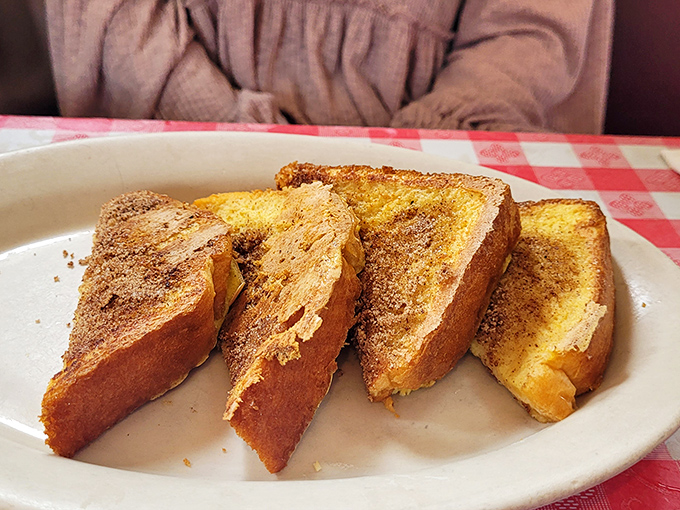 Four slices of cinnamon-kissed heaven that prove French toast doesn't need fancy toppings when the basics are done this perfectly. This is breakfast's greatest hit.
