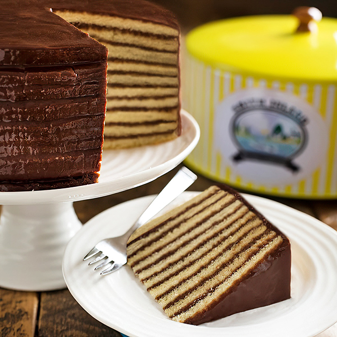 The cross-section reveals the architectural marvel within – ten perfect layers that would make Frank Lloyd Wright weep with joy.