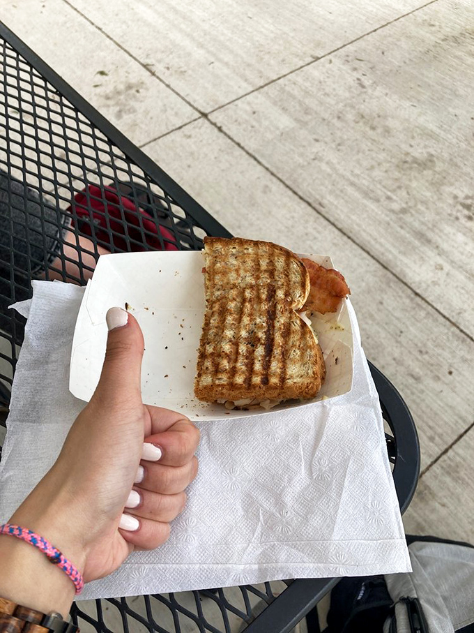 That perfect bite moment captured—when the bread has the ideal crunch and everything inside is melty harmony. Worth driving across county lines for.