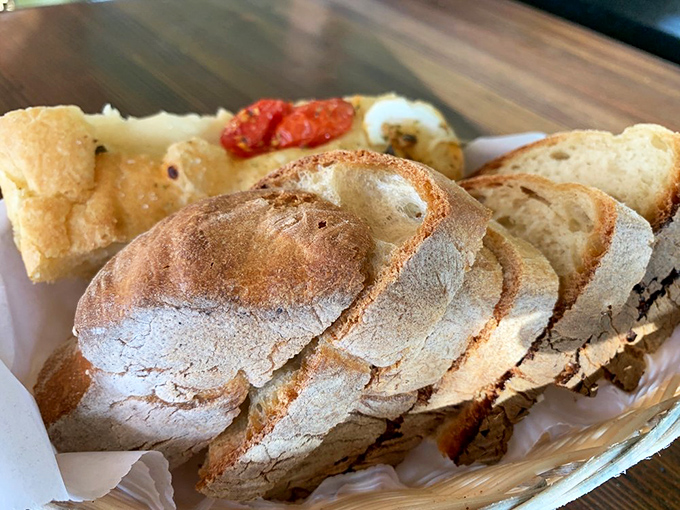 This isn't just bread; it's the opening act to a magnificent meal. Crusty, rustic, and demanding to be dipped in something delicious.