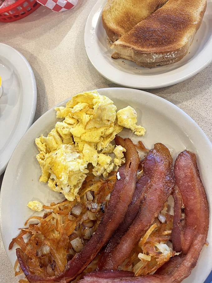 The holy trinity of breakfast&mdash;golden eggs, crispy bacon, and hash browns that somehow manage to be both crispy and tender.