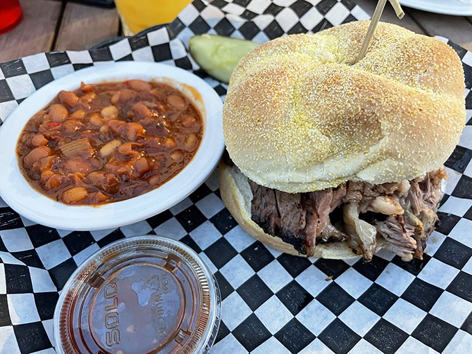 This pulled pork sandwich with baked beans isn't just lunch&mdash;it's an event. The beans alone could start a religion.