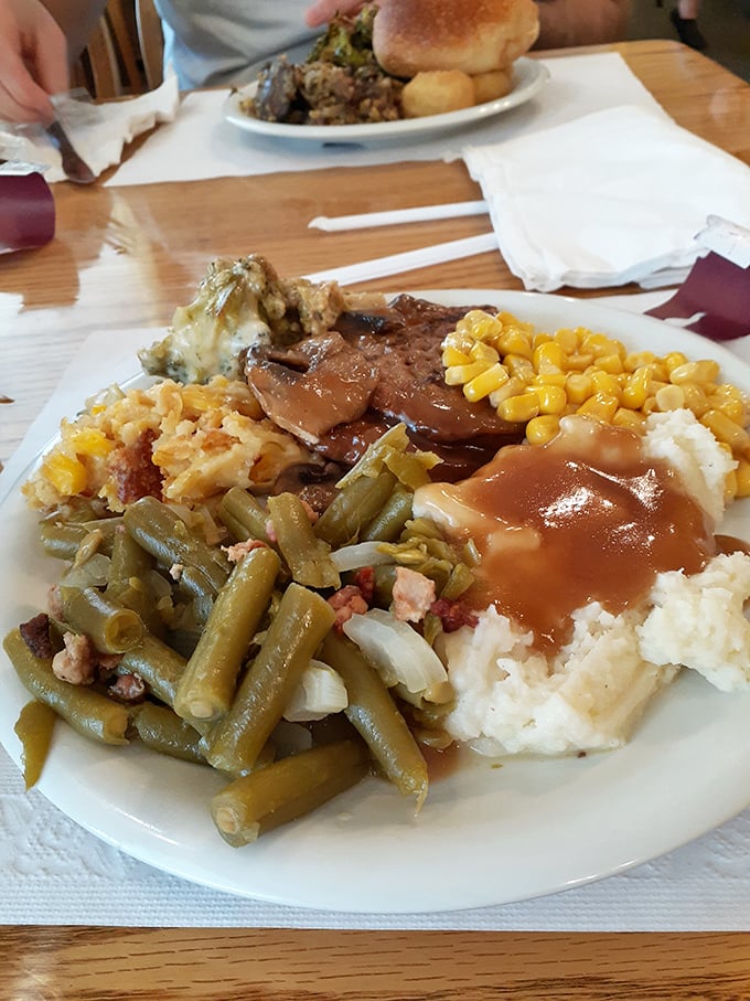 The ultimate plate of contentment. Gravy creating delicious rivers through mashed potato mountains, while green beans and sweet corn stand ready for their moment of glory.