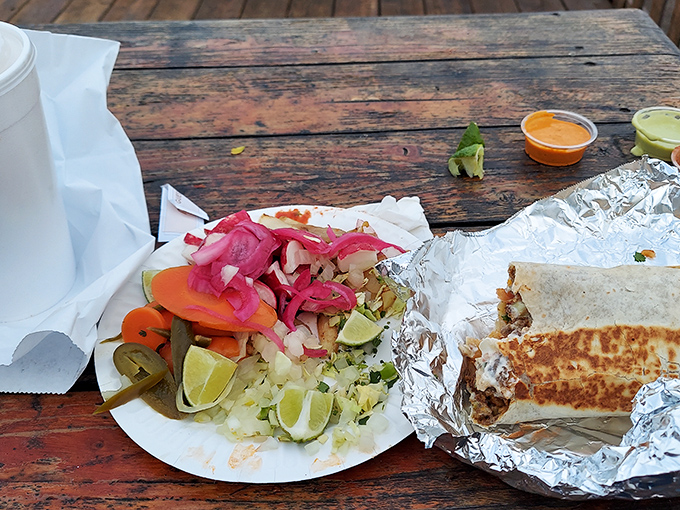A proper burrito comes with its own entourage&mdash;pickled vegetables and lime wedges that cut through richness like a well-timed punchline. 