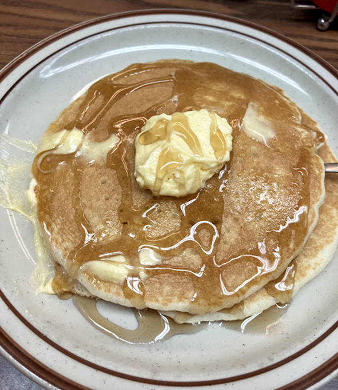 These pancakes aren't just breakfast, they're an edible pillow fort of comfort food topped with melting butter and syrup.