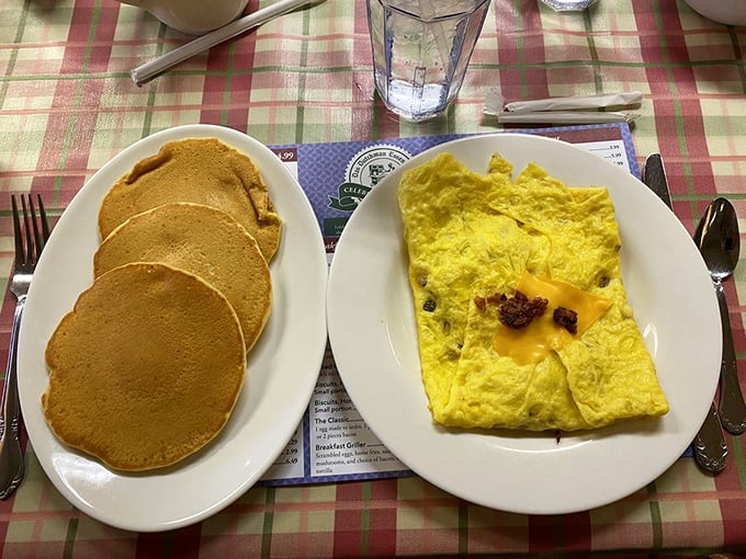 Pancakes golden as Midwest sunshine paired with an omelet so fluffy it practically needs its own zip code. This is breakfast worth setting your alarm for.