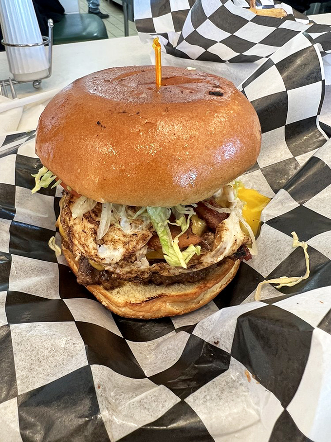 Some burgers are just burgers. This towering creation with its perfectly toasted bun is more like a life event with lettuce.