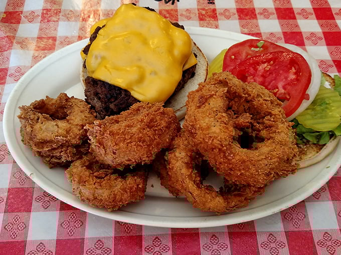 The cheeseburger and onion rings platter that makes you question why anyone would ever eat anything else. Those rings are golden halos of deliciousness.