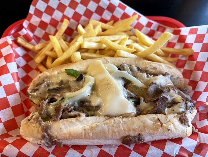 Behold the cheesesteak in its natural habitat &ndash; tender meat and melted cheese embracing each other on a pillow of fresh bread.