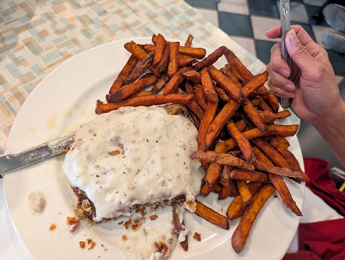 Country-fried steak smothered in gravy that could make a vegetarian reconsider life choices. Those sweet potato fries aren't sidekicks&mdash;they're co-stars in this comfort food blockbuster.