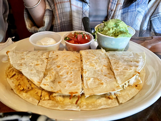 This quesadilla isn't just folded&mdash;it's packed with enough filling to make Marie Kondo question her life choices. Pure cheesy joy!