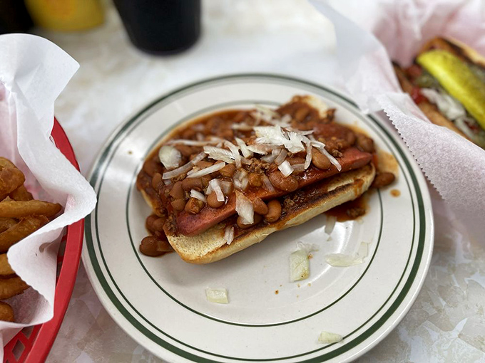 This chili dog isn't just topped&mdash;it's smothered in a blanket of homestyle beans and diced onions. Napkins: non-negotiable.