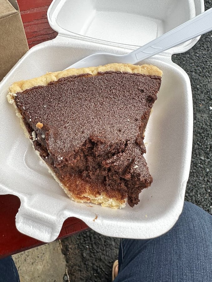 Chocolate chess pie with its pudding-like interior and delicate top layer proves that simplicity, when executed perfectly, is the highest form of culinary art.