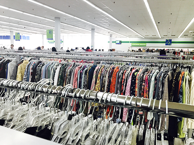The clothing section stretches toward the horizon like a textile sea, each rack a different island of possibility in an archipelago of affordable fashion.