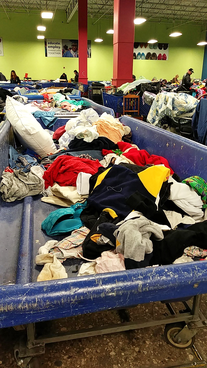 A textile mountain range where fashion from every decade collides&mdash;somewhere in this fabric landscape is the vintage band shirt you've been seeking since 1992.