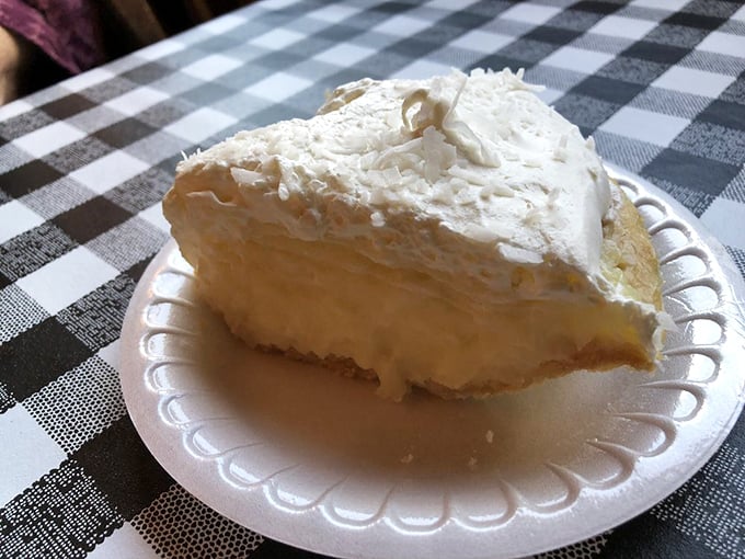 The coconut cream pie wears its cloud-like meringue with the confidence of something that knows it's about to be the highlight of your day.