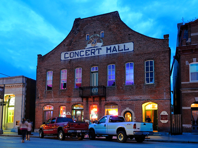Concert Hall and Barrel Tavern glows at dusk, luring visitors with the promise of nightcaps and stories in a building that's seen it all.