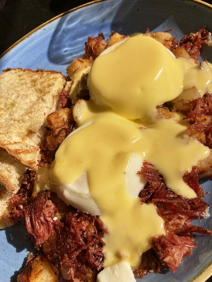 This isn't just corned beef hash—it's a masterclass in breakfast architecture, with each forkful offering the perfect ratio of crispy to tender.