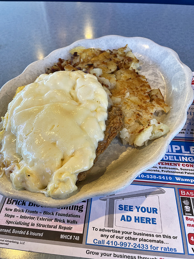 Country fried steak with a side of hash browns that have achieved that perfect crisp-to-tender ratio. Comfort food engineering at its finest.