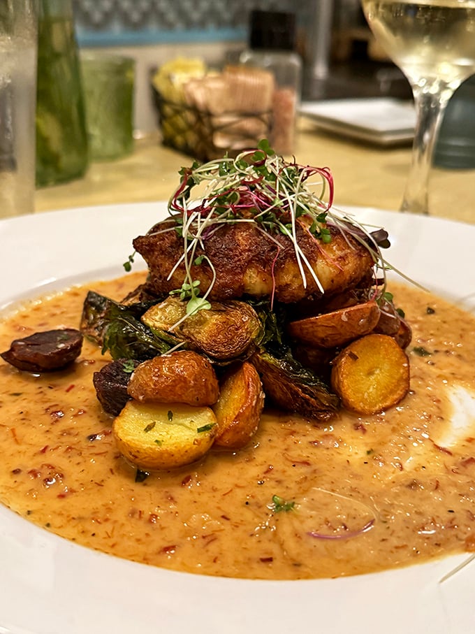 When a crab cake gets the royal treatment &ndash; perched atop roasted potatoes and greens with a sauce that demands bread for mopping.