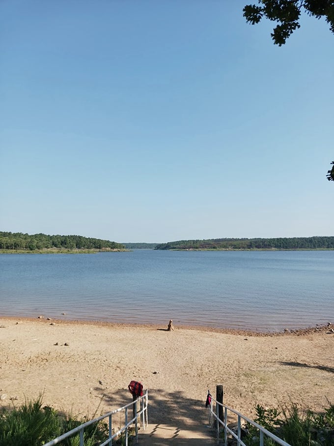 The sandy beach area invites you to dip your toes in the cool waters&mdash;nature's own stress-relief therapy without the spa prices.