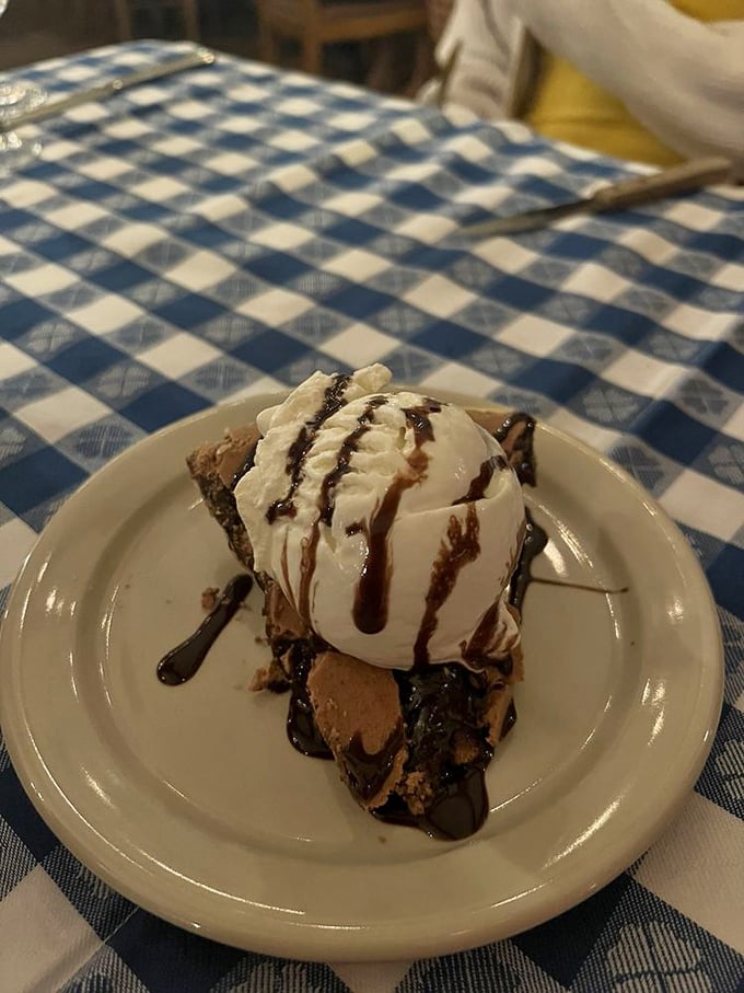 This chocolate chess pie doesn't just satisfy a sweet tooth&mdash;it creates lifelong devotees. That whipped cream dollop is merely the perfect supporting actor.