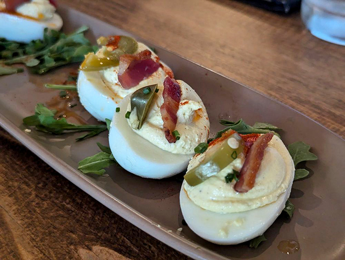 A lineup of deviled eggs that would make angels jealous. The bacon adds a smoky crunch that transforms this classic into something transcendent.