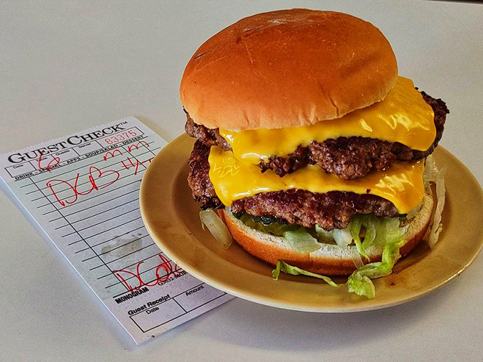 The double cheeseburger that launched a thousand food pilgrimages. Two substantial patties and melted cheese create a tower of flavor that demands a two-handed salute.