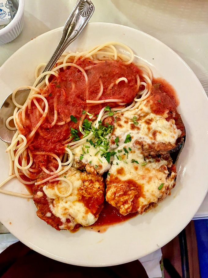 Eggplant parmigiana that doesn't apologize for wearing both marinara and cheese. The ultimate Italian fashion statement on a plate.