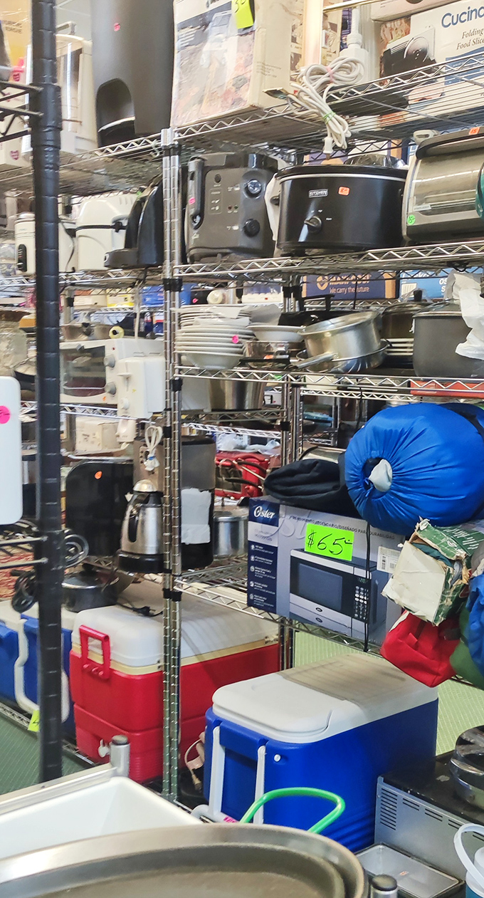 Kitchen appliances stacked like a game of retail Tetris&mdash;where someone else's "no counter space" becomes your "perfect price" opportunity.