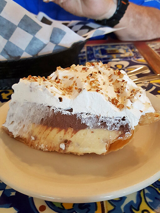 Arkansas' famous Possum Pie in its full glory—chocolate, cream cheese, and whipped topping conspiring to create the perfect dessert deception.