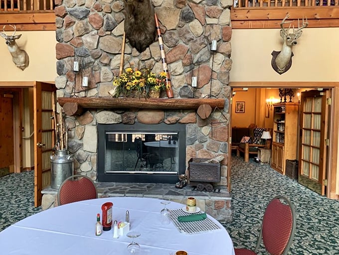 The heart of the lodge: A stone fireplace that could tell stories of many gatherings, framed by craftsmanship that celebrates nature's majesty.