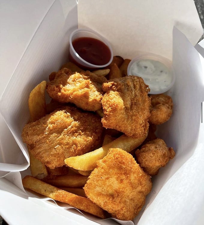 The paper boat serving vessel is entirely appropriate&mdash;these fish chunks have completed their journey from ocean to fryer to your eager hands. 