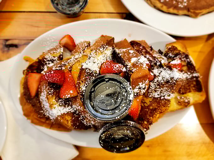 French toast that makes ordinary bread weep with jealousy. Those strawberries aren't just garnish&mdash;they're jewelry for your breakfast.