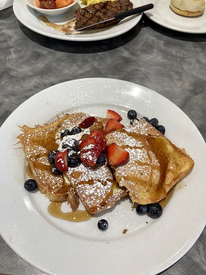 French toast that doesn't just feed you &ndash; it hugs you from the inside out with berries, powdered sugar, and pure joy.