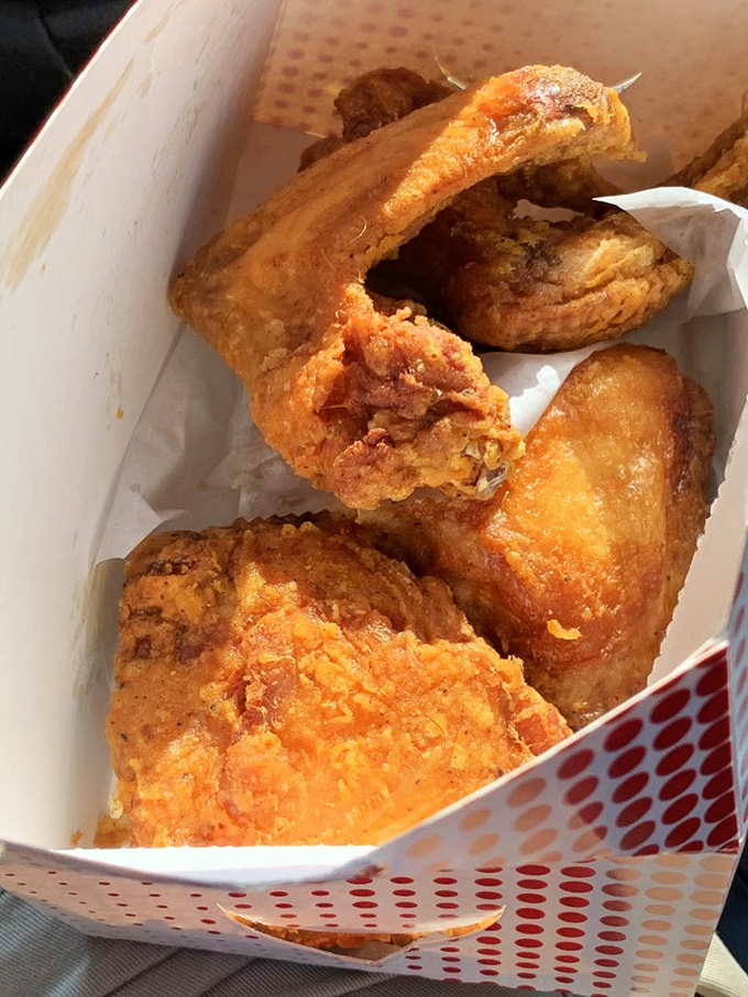 The holy trinity of fried chicken: crispy exterior, juicy interior, and that unmistakable aroma that makes your stomach growl from across the room.